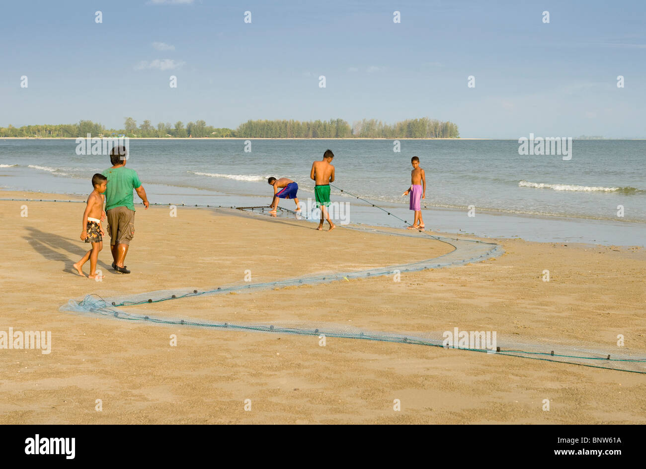 Laying out the fishing nets in South Thailand Stock Photo - Alamy