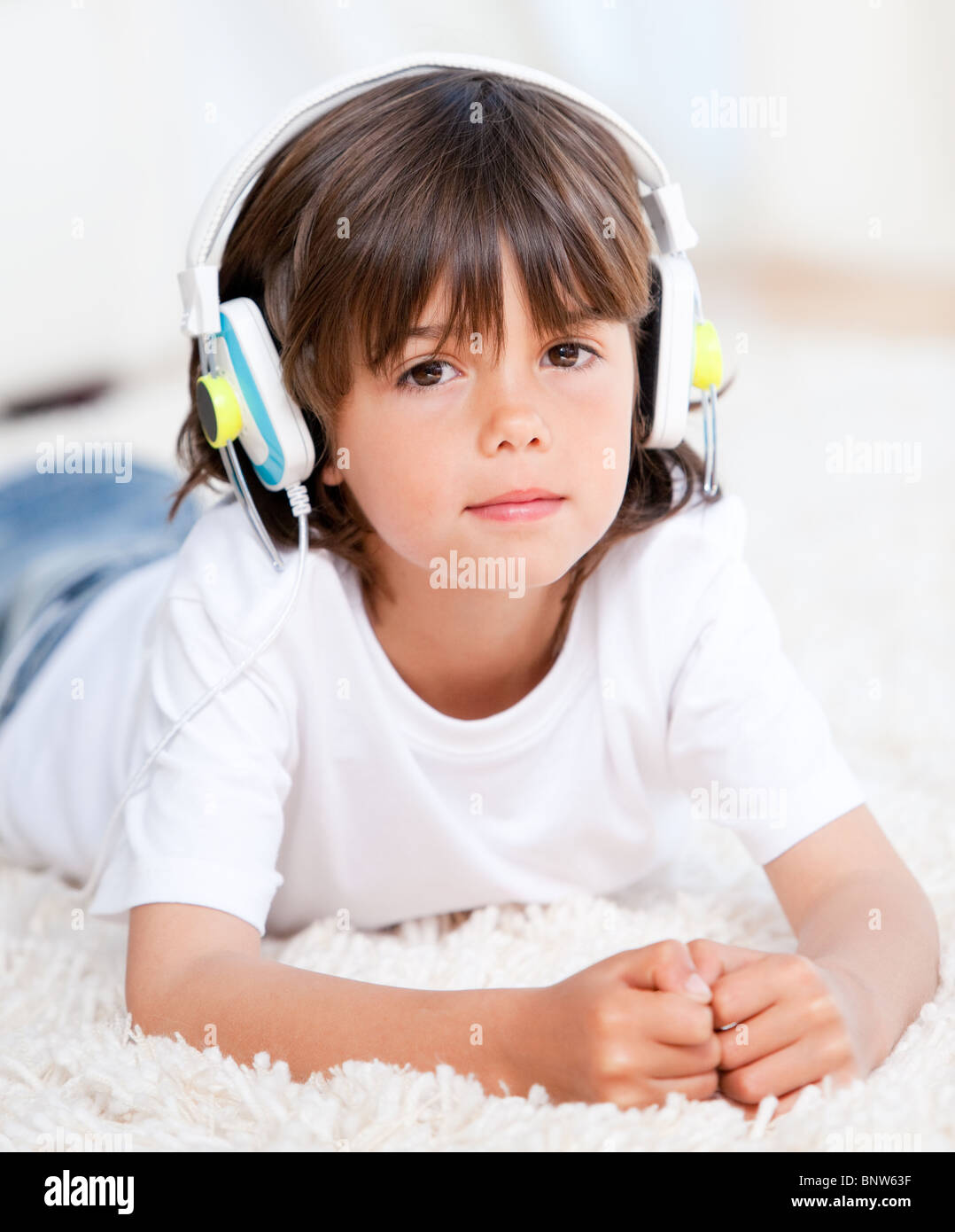 Relaxed boy listenning music Stock Photo - Alamy