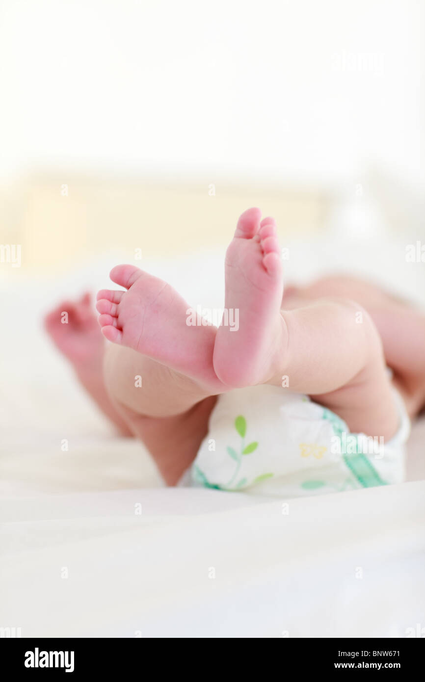 Baby resting in bed Stock Photo - Alamy
