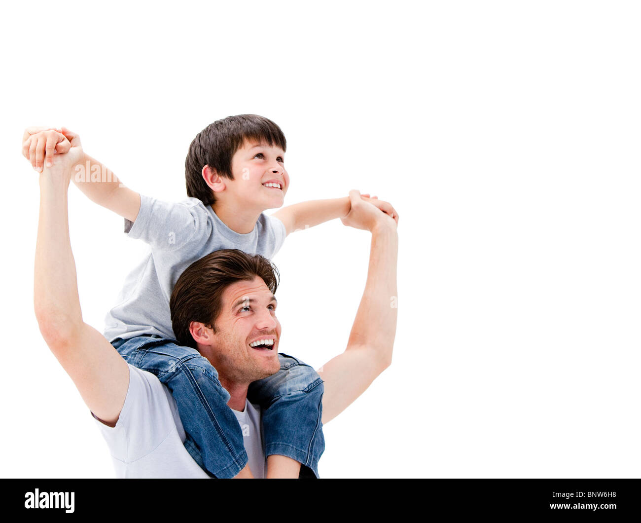 Father giving a piggyback to his son Stock Photo - Alamy