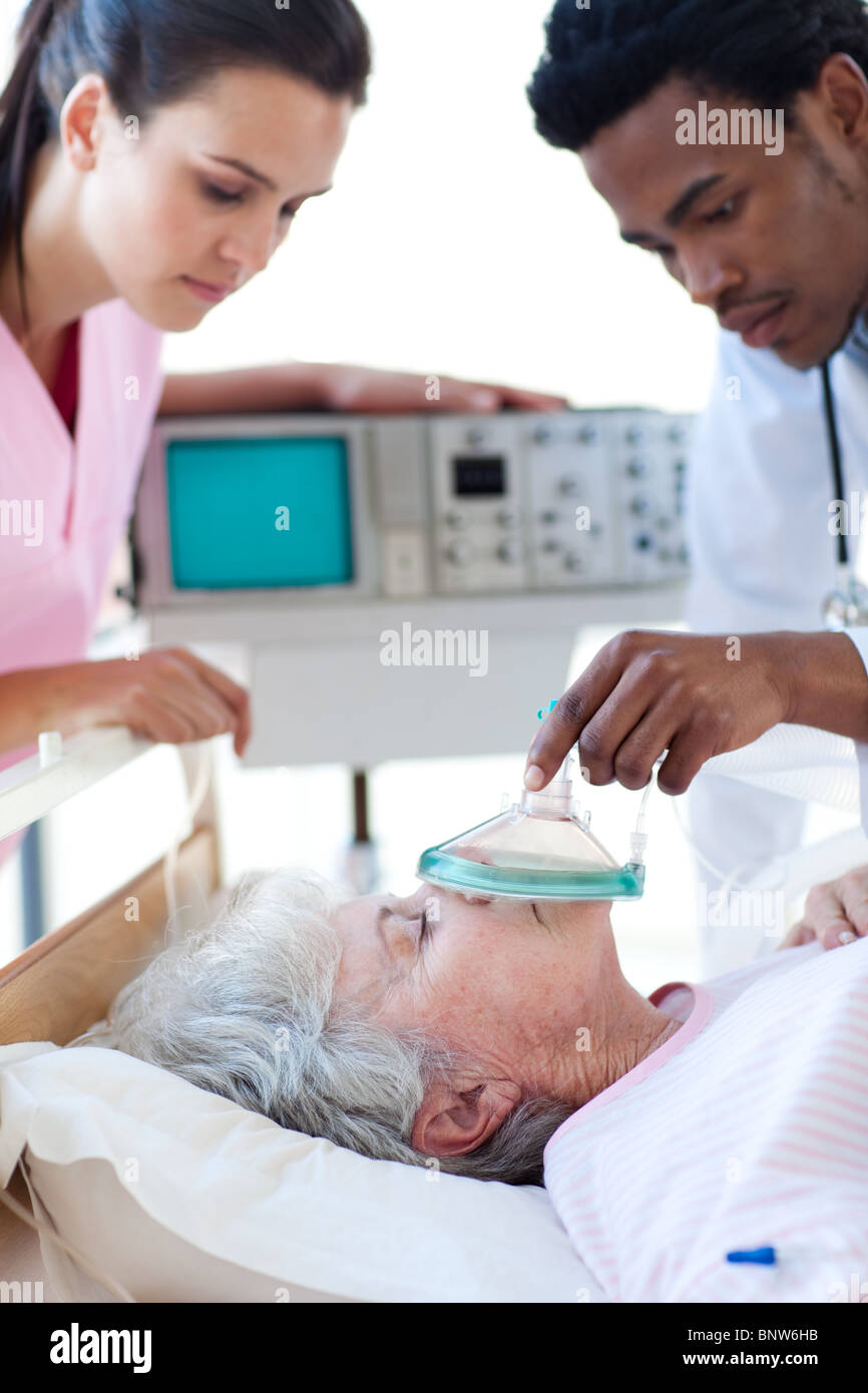 Medical team resuscitating a senior patient Stock Photo - Alamy