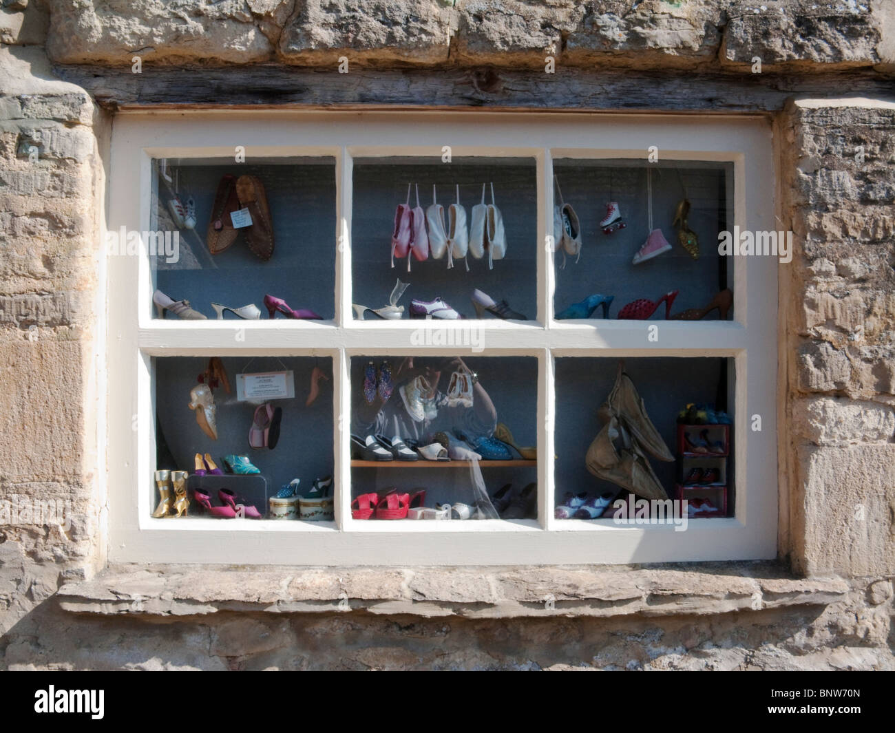 Miniature shoes in a shop window in Fairford, Gloucestershire UK Stock ...