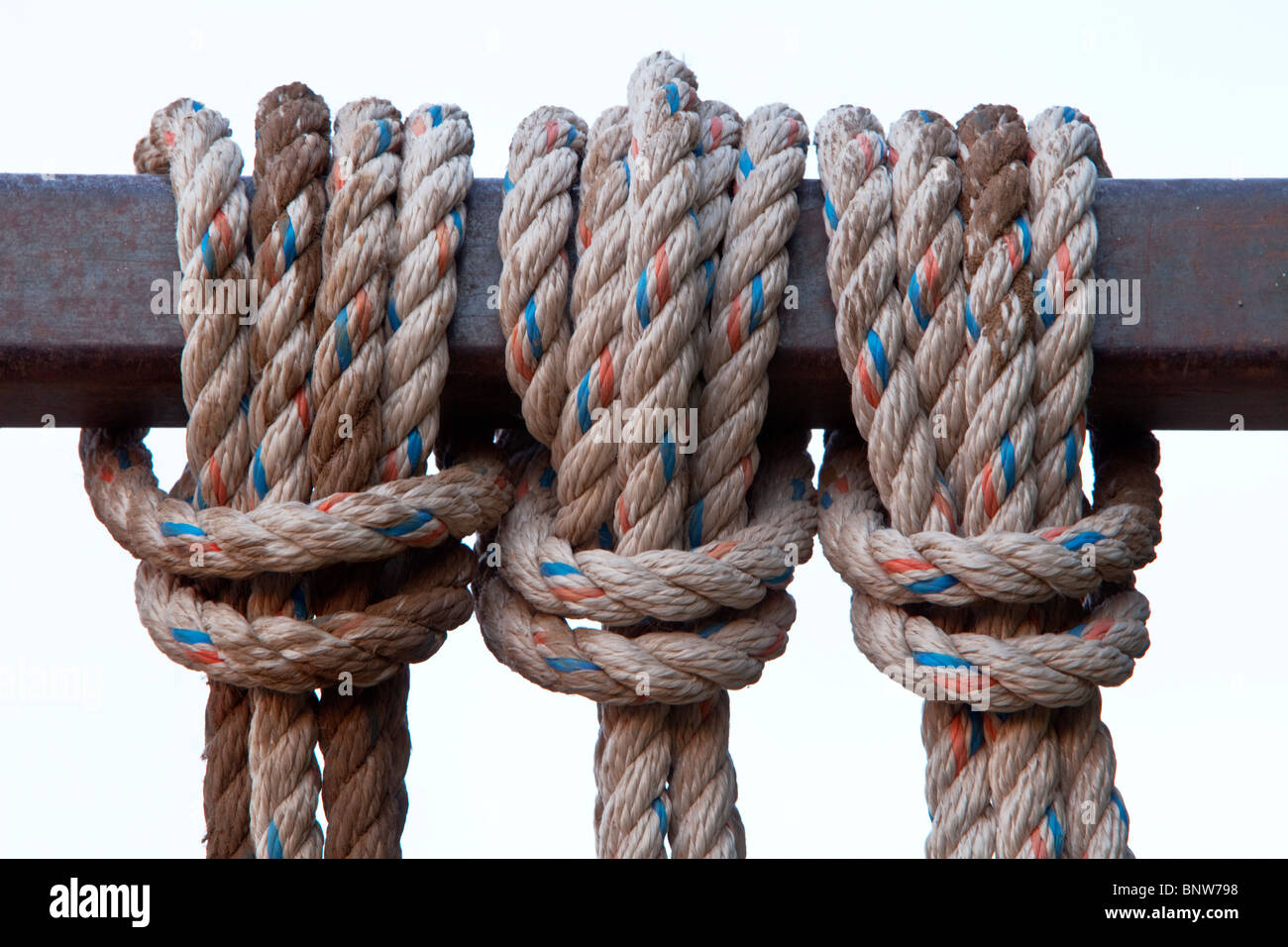 Reverse Lark's Head knots over metal bar Stock Photo - Alamy
