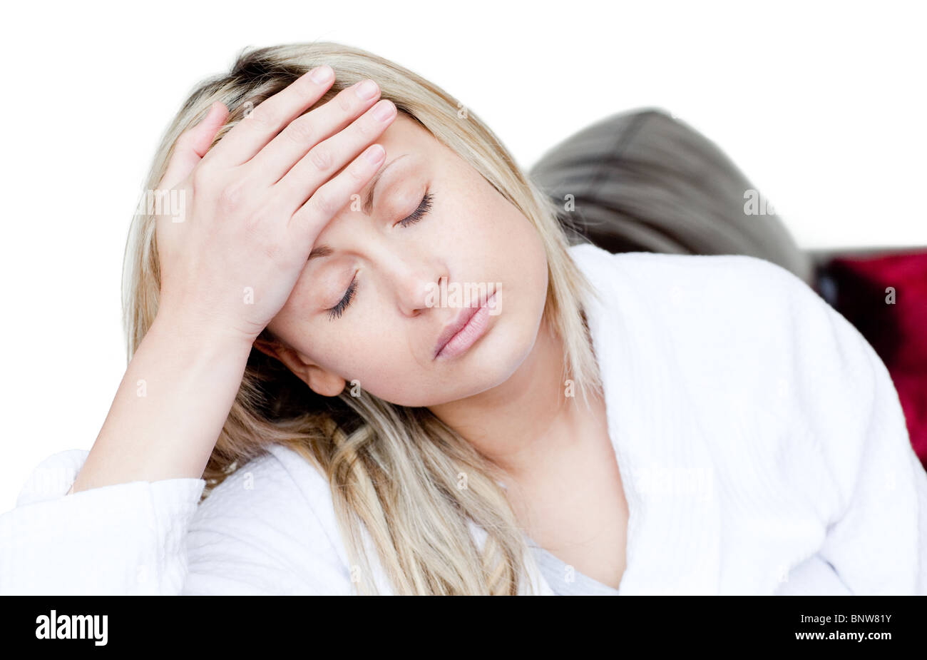 Tiring woman sitting on a sofa Stock Photo - Alamy