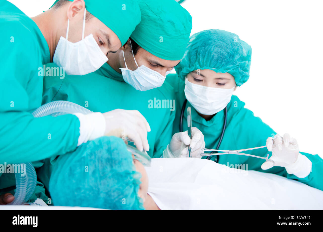 Professionnal medical team using surgery equipment on a patient Stock ...