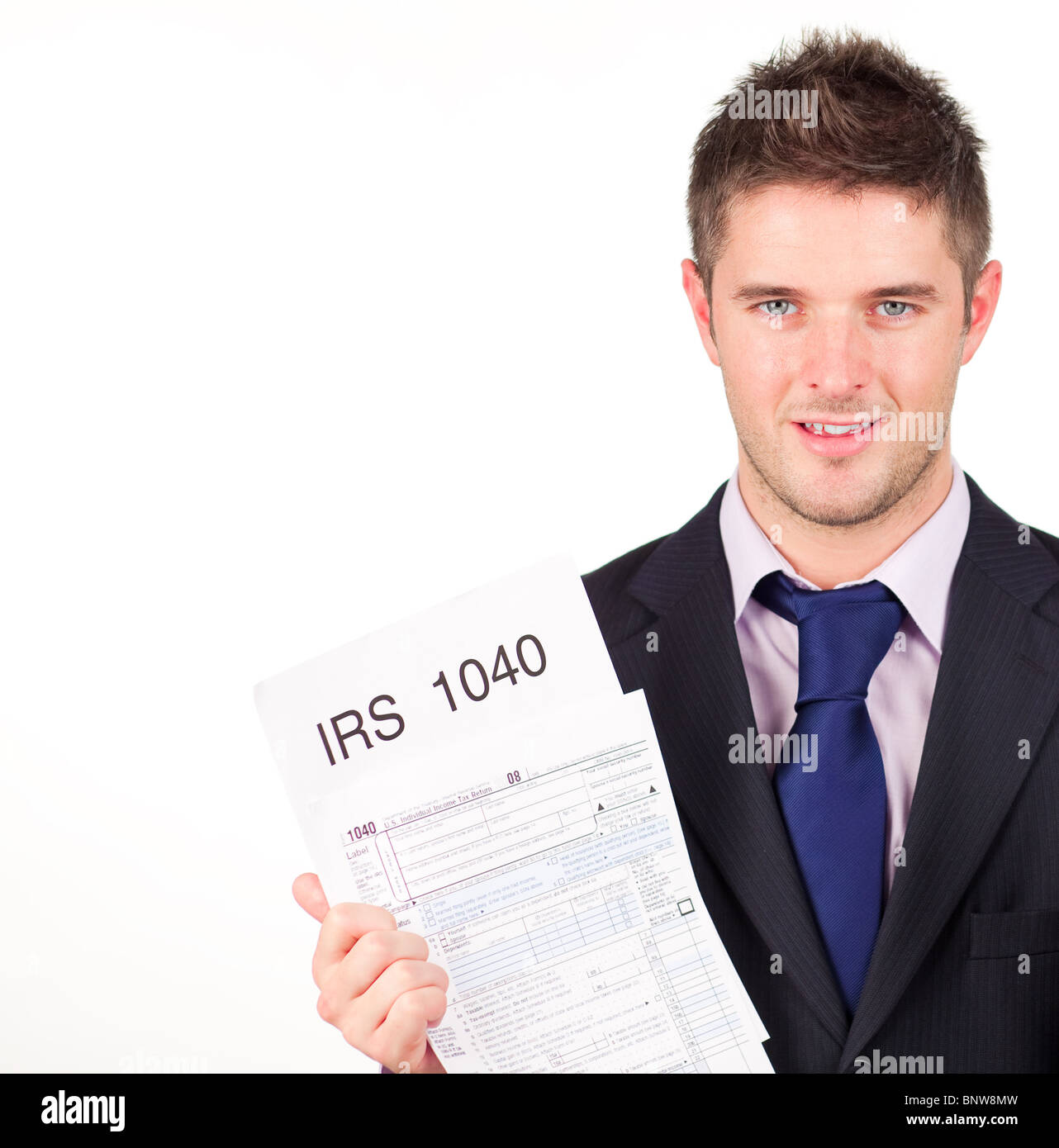 Man holding out his irs returns form Stock Photo - Alamy