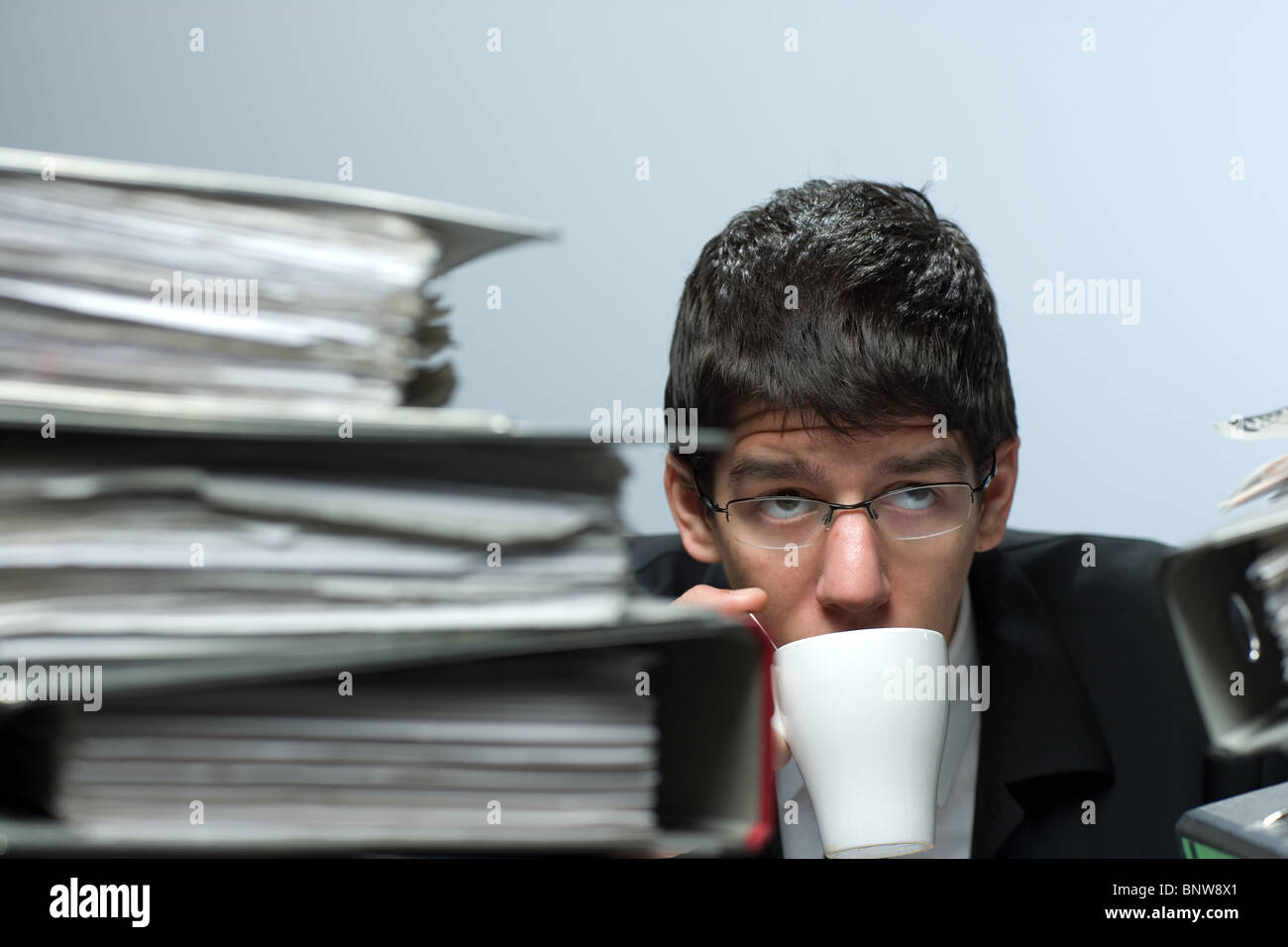 Accountant drinking coffee at work Stock Photo - Alamy