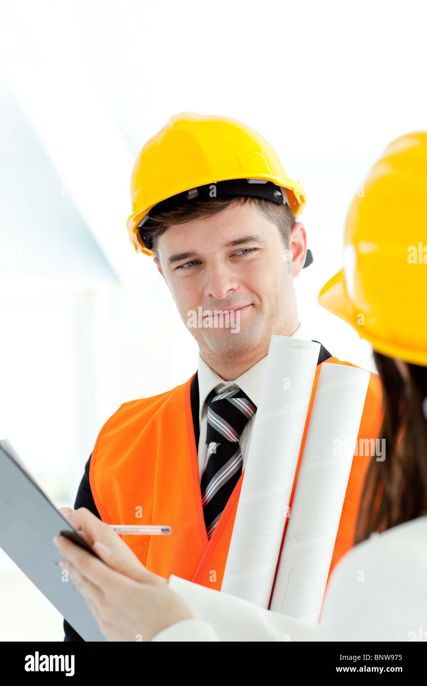 Handsome architect discussing with his colleague Stock Photo - Alamy