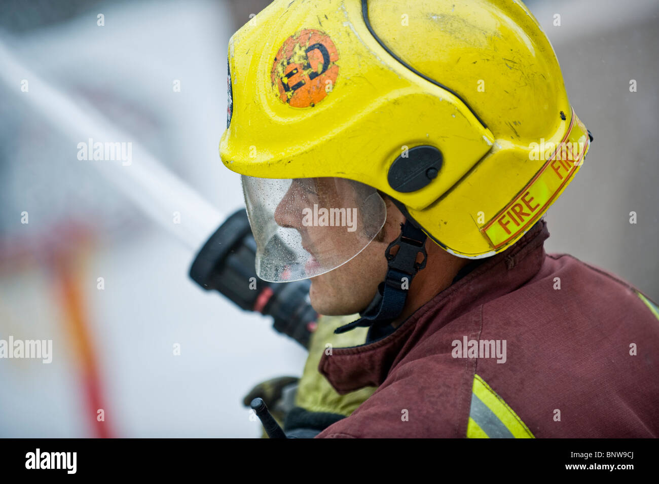 Members of the London Fire Service, some in breathing apparatus, go ...