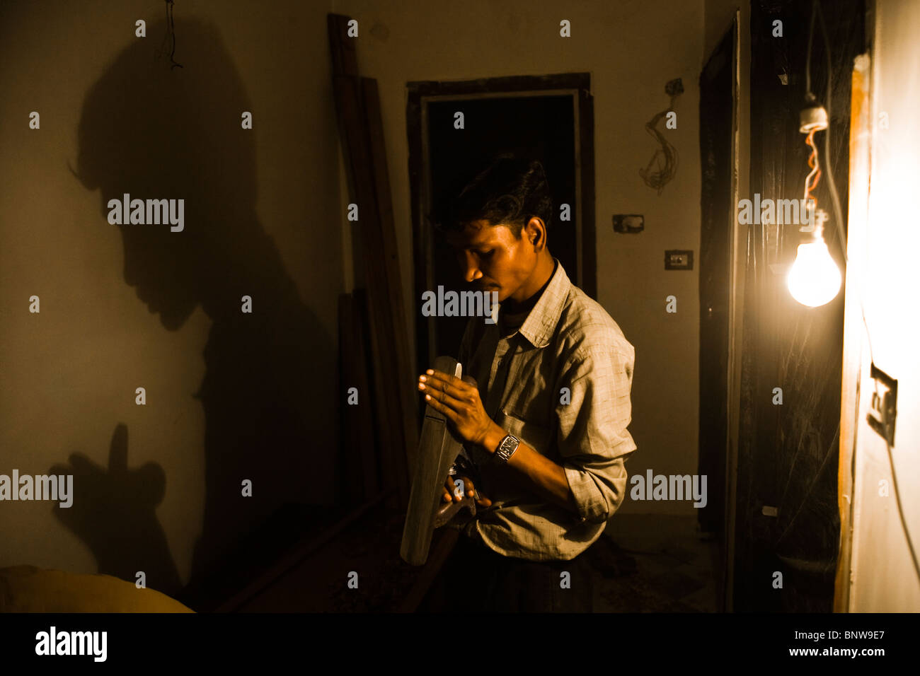 Carpenter adjusting his Plane in India Stock Photo - Alamy