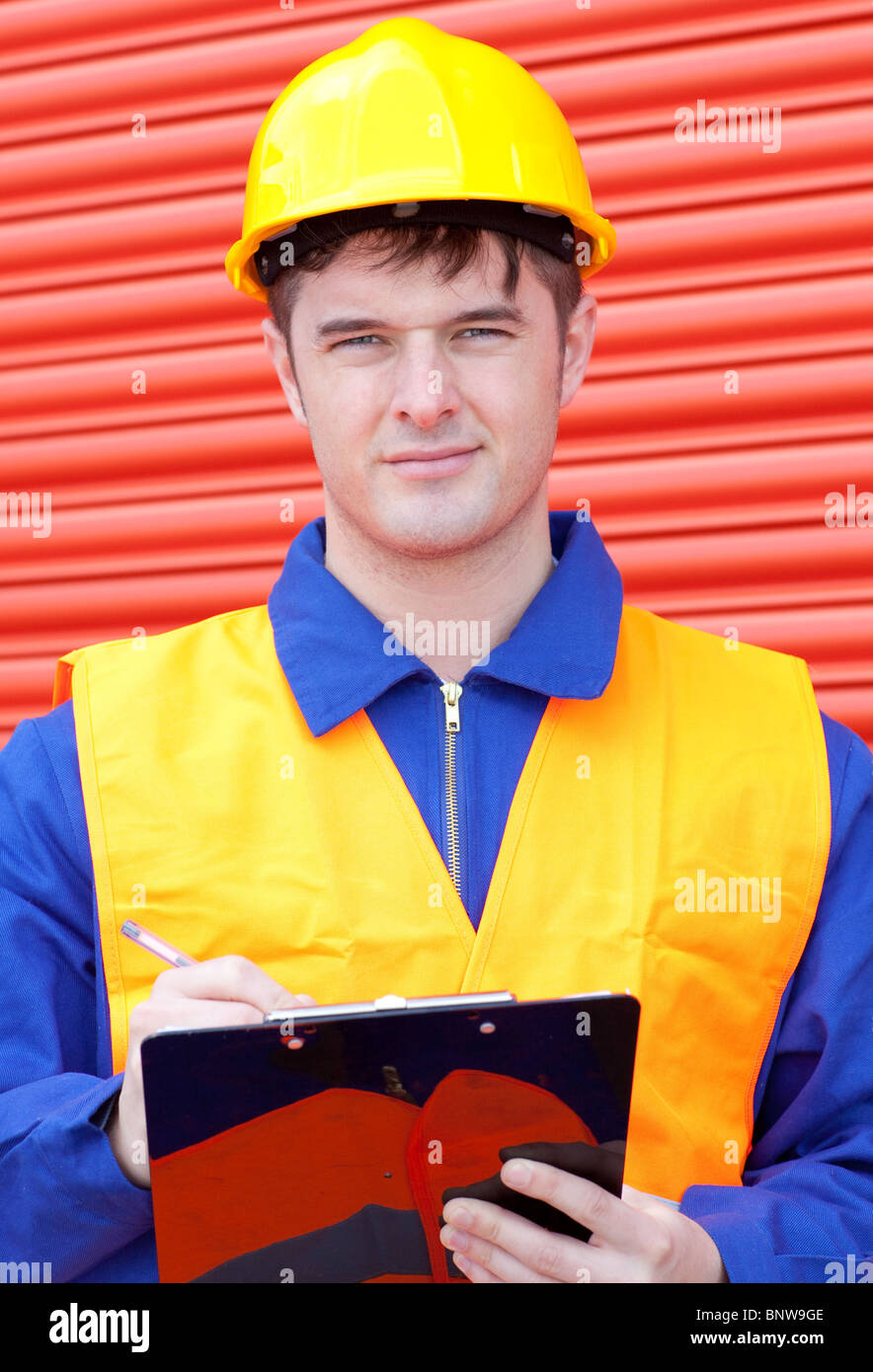 Male engineer writing his report Stock Photo - Alamy