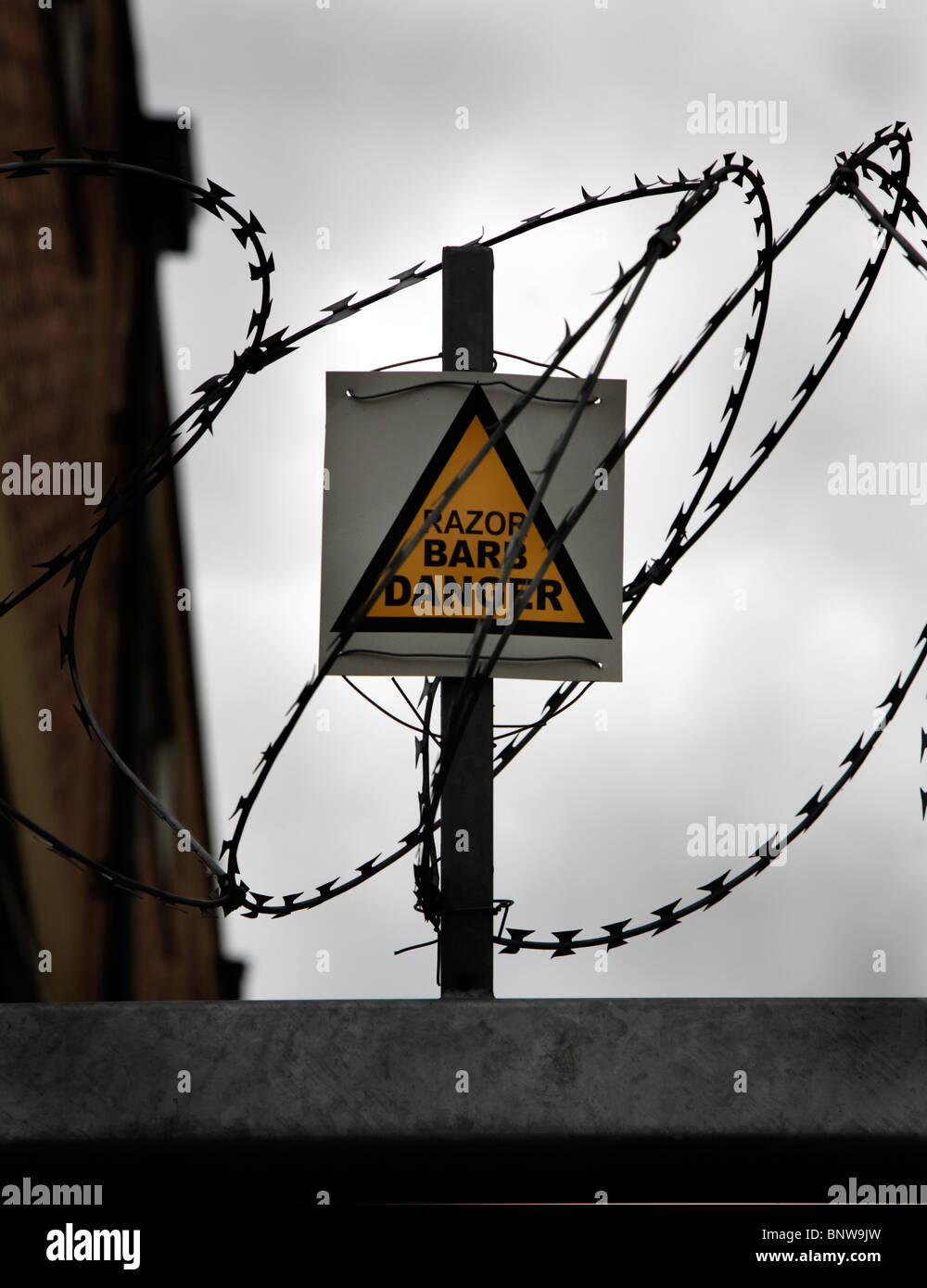 Razor Wire Fence Warning Sign Stock Photos & Razor Wire Fence Warning ...