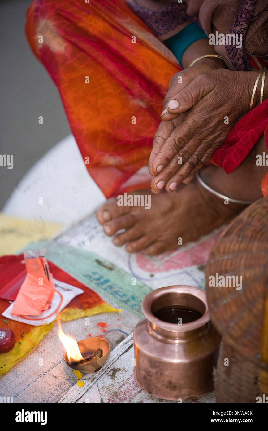woman praying during the Magh Mela in Allahabad, India Stock Photo - Alamy