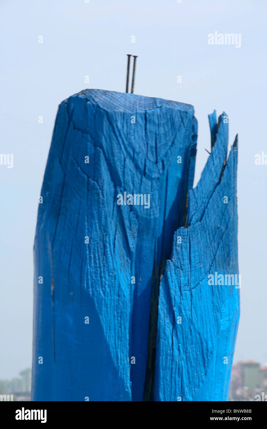Blue Pole with nails in Stock Photo - Alamy