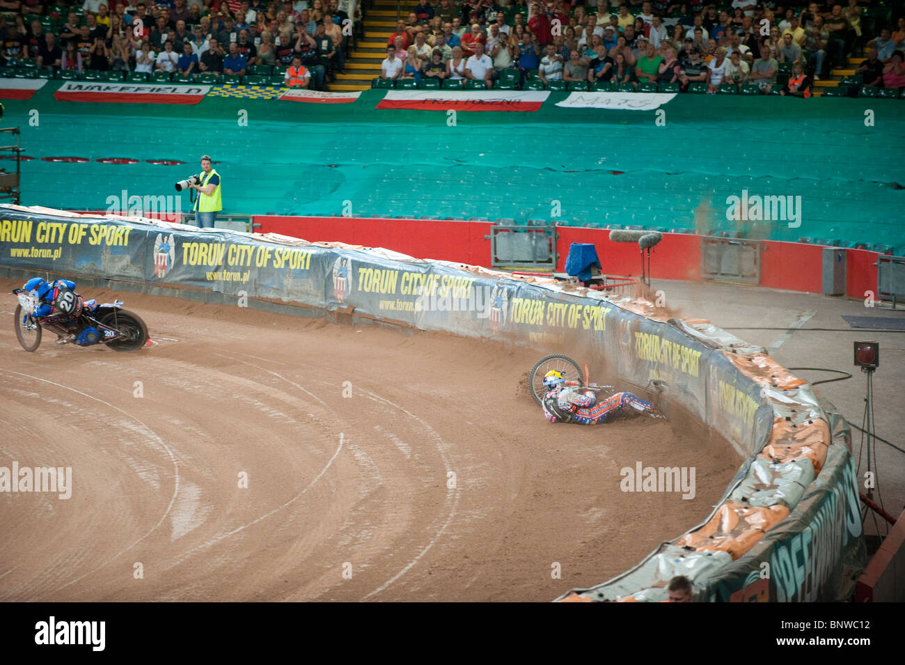 2010 British Speedway Grand Prix. Jason Crump hits the air fence after ...