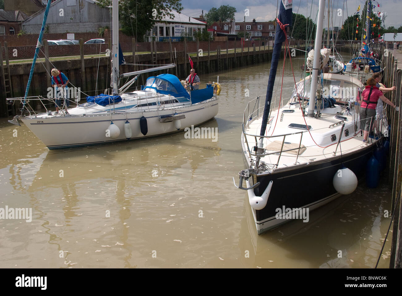 tied sail sailing boat casting off sailor mooring Stock Photo - Alamy