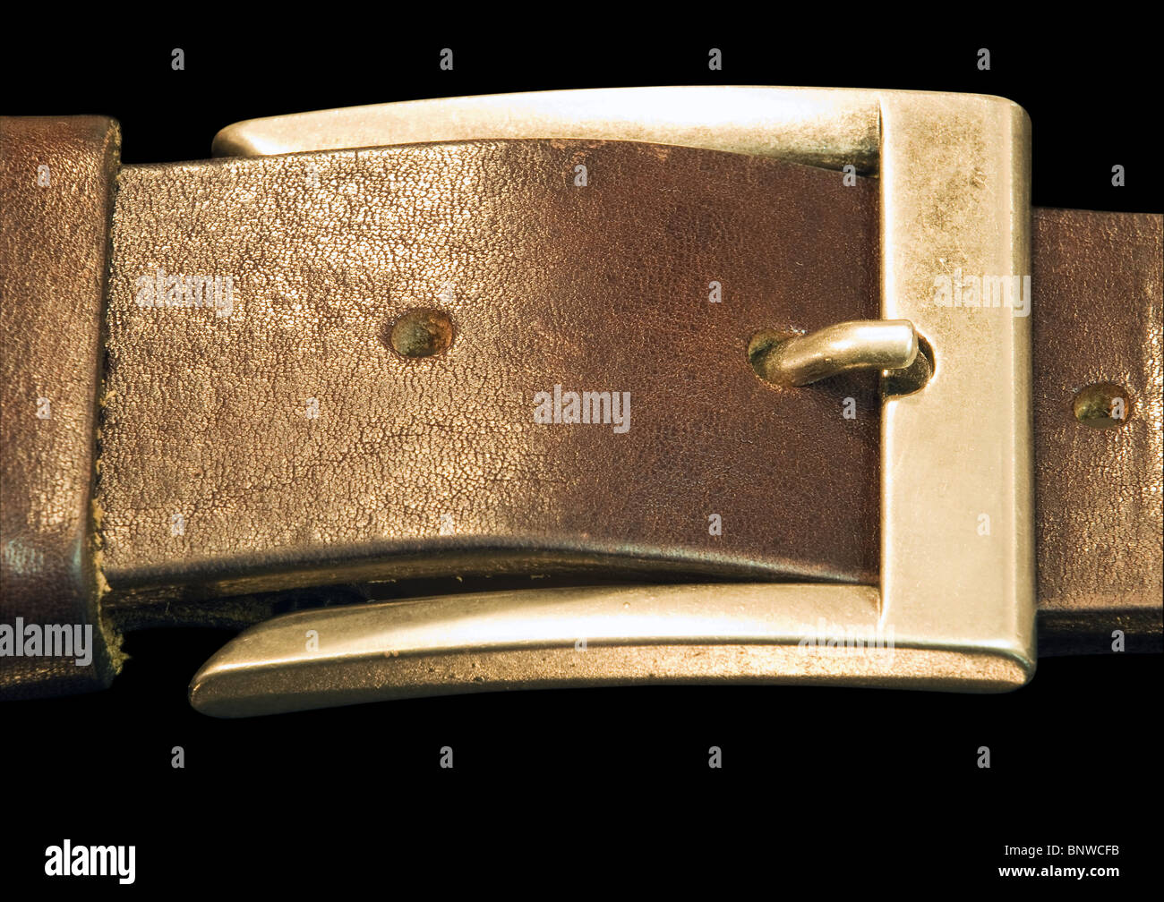 Classic belt buckle isolated on a black background Stock Photo - Alamy