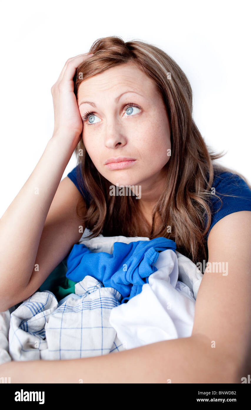 Upset woman doing laundry Stock Photo - Alamy
