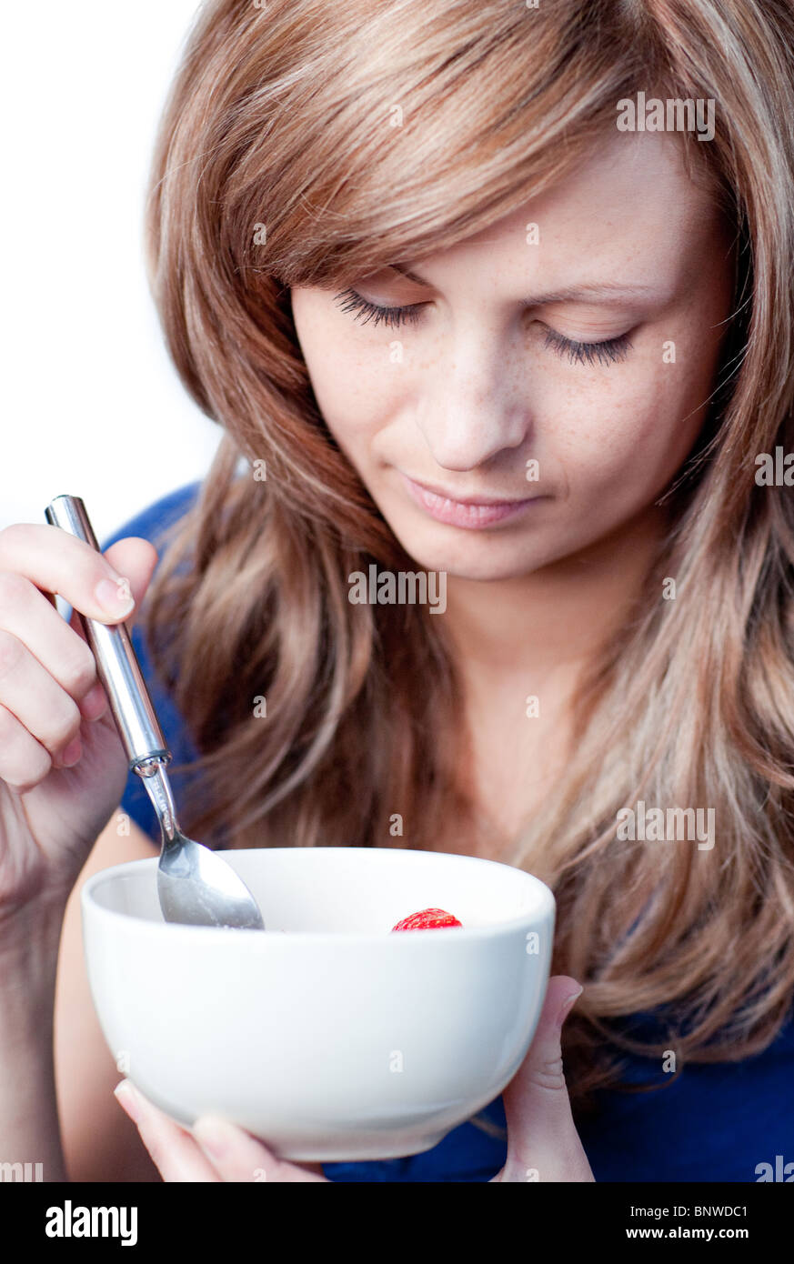 Beautiful woman eating cereals Stock Photo - Alamy