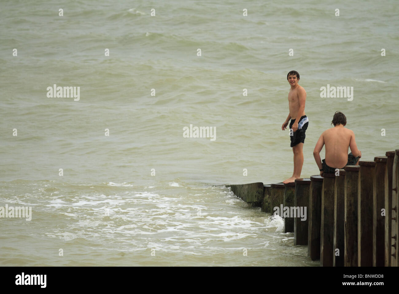 Two boys jumping into the sea hi-res stock photography and images - Alamy