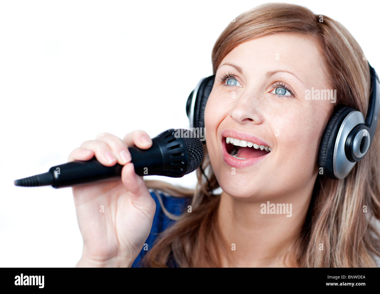 Cute woman using a microphone Stock Photo - Alamy