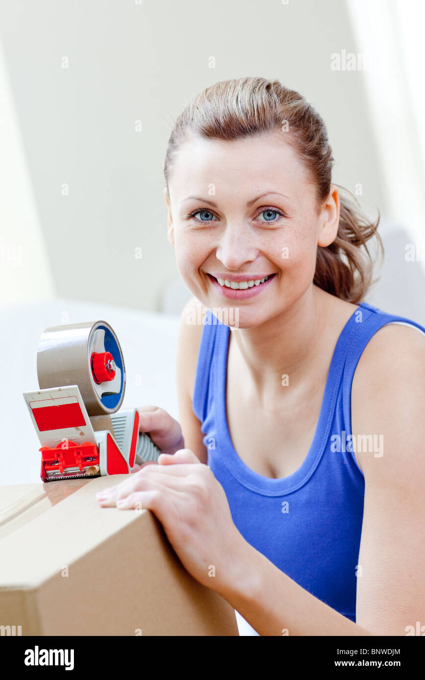 Radiant woman packing boxes in the living-room Stock Photo - Alamy