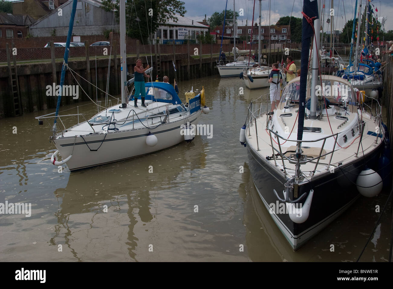 tied sail sailing boat casting off sailor mooring Stock Photo - Alamy