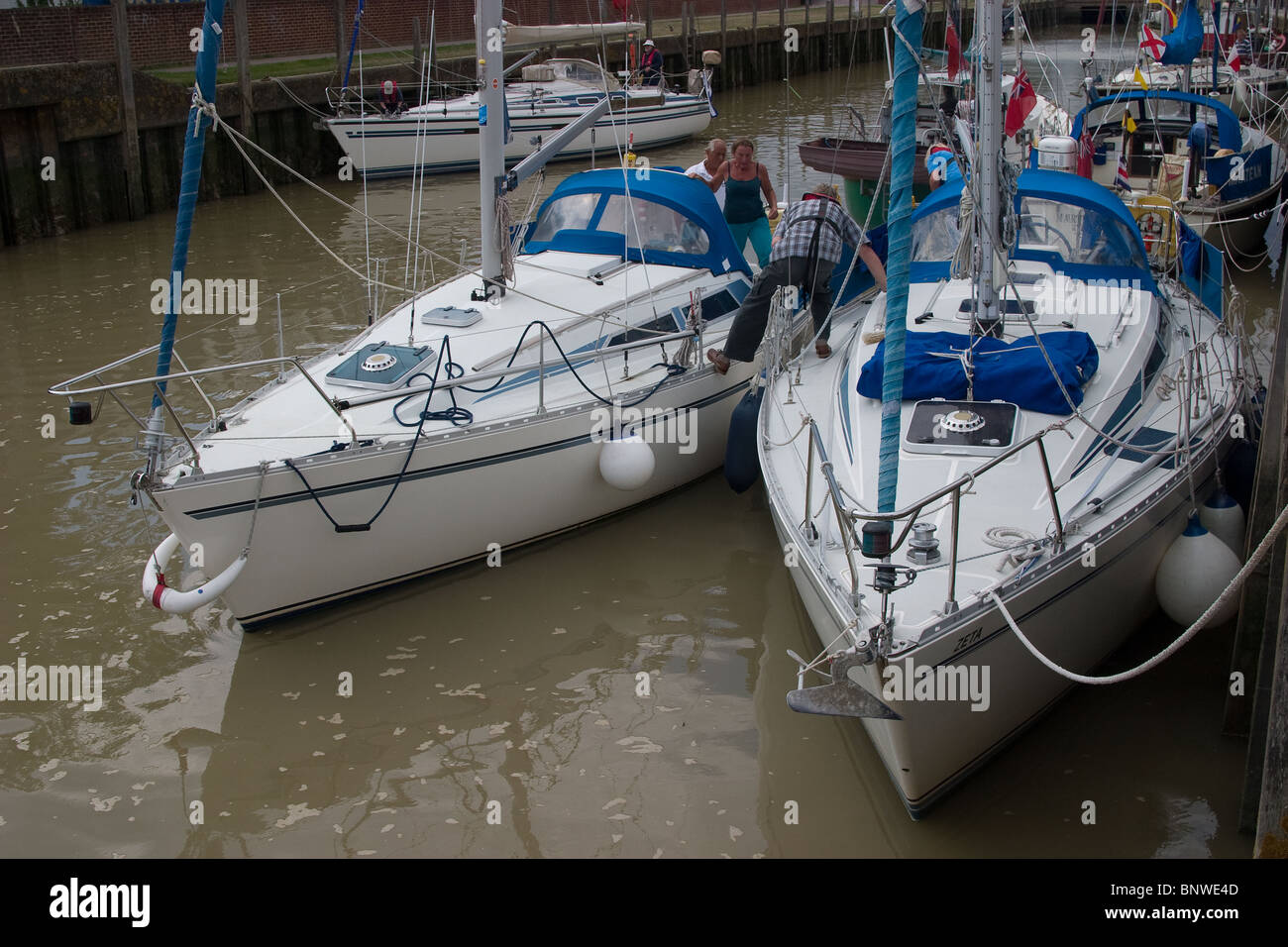 tied double berthed sailing boat sailors smiling Stock Photo - Alamy