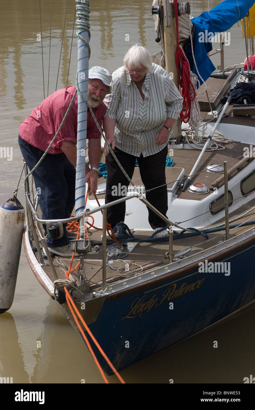 tied double berthed sailing boat sailors talking Stock Photo - Alamy