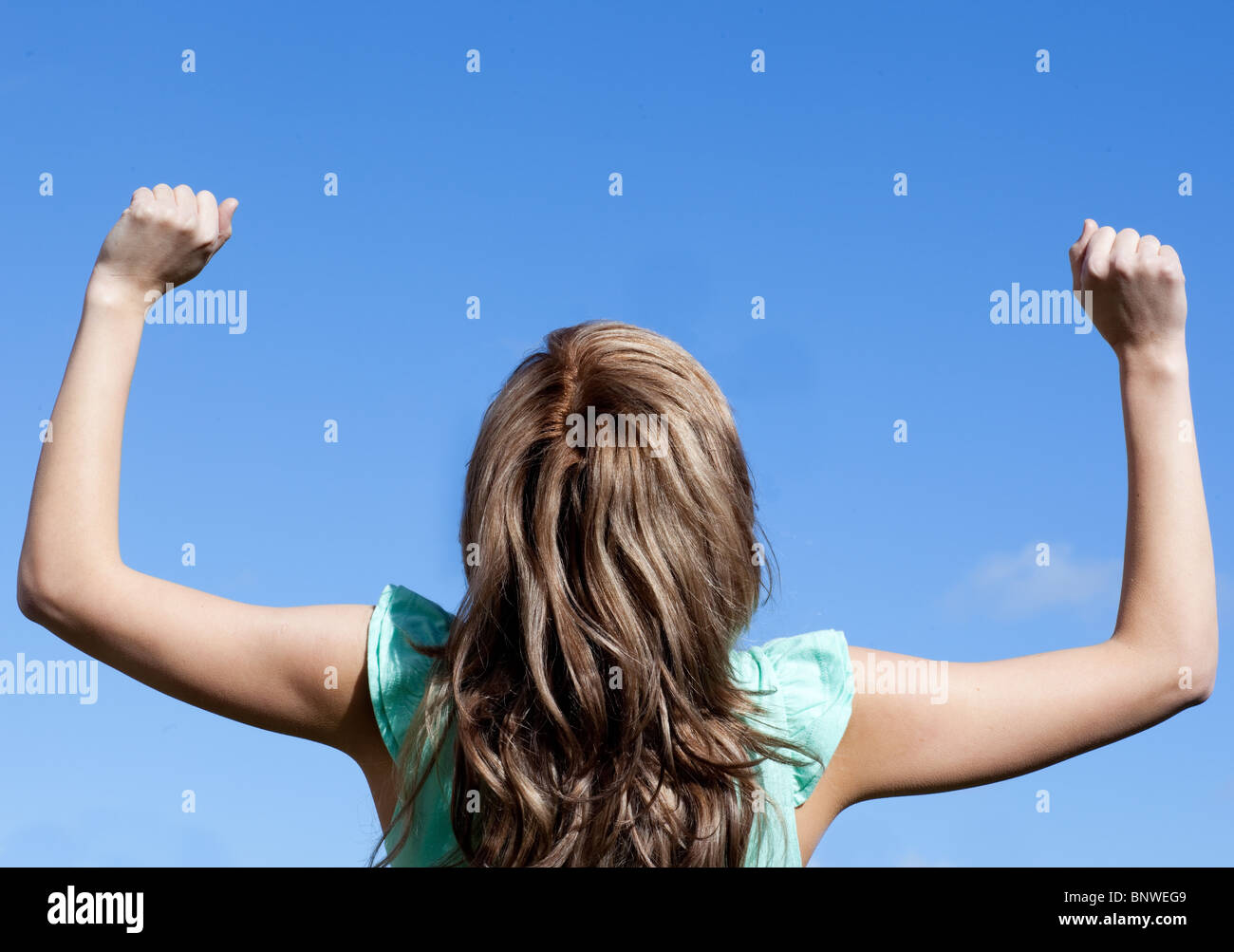 Attractive woman punching the air outdoor Stock Photo - Alamy