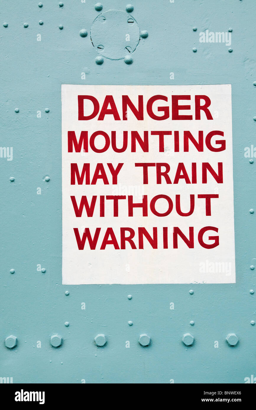 Danger Mounting May Train Without Warning sign Stock Photo - Alamy