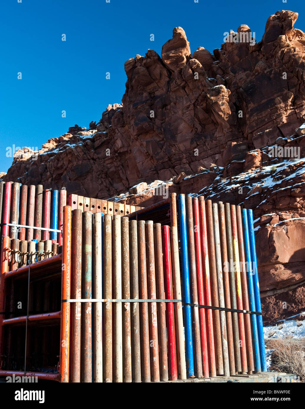 Colorful construction scaffolding stacked and stored Stock Photo - Alamy
