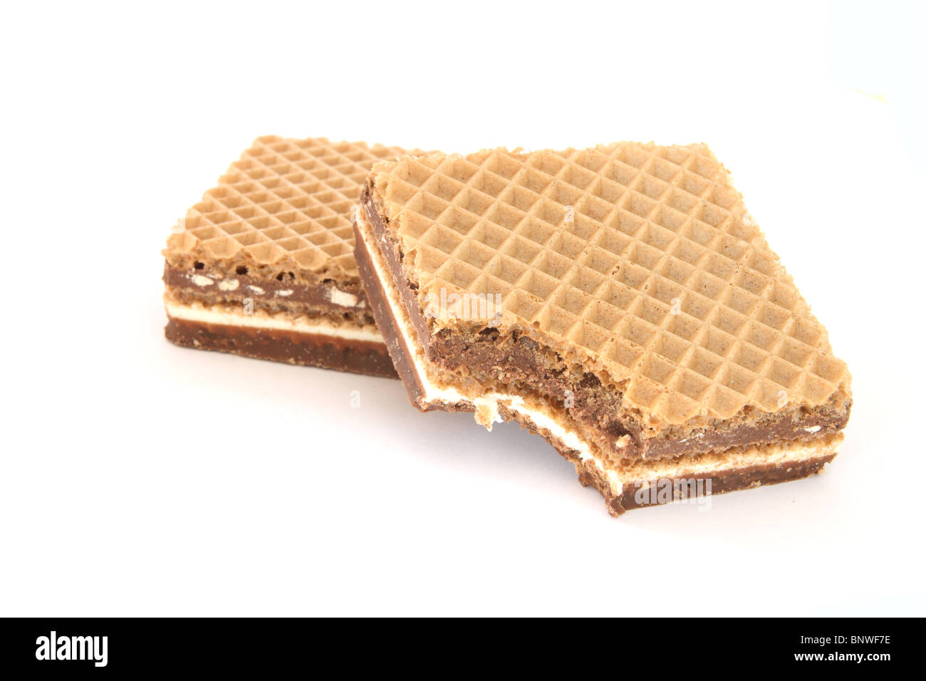 Two crunchy filled wafers with cacao cream and nuts Stock Photo - Alamy