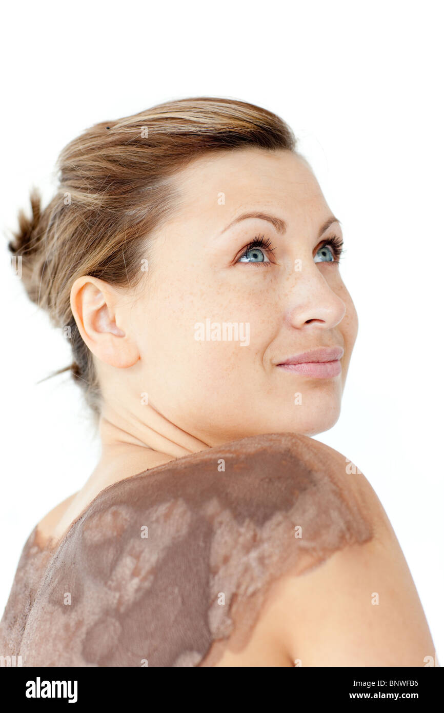 Portrait of a woman enjoying a mud skin treatment Stock Photo - Alamy