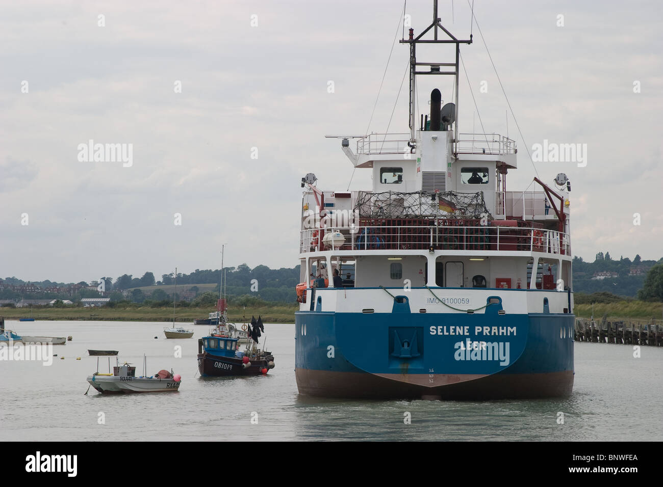 small cargo boat tanker river channel navigating Stock Photo - Alamy