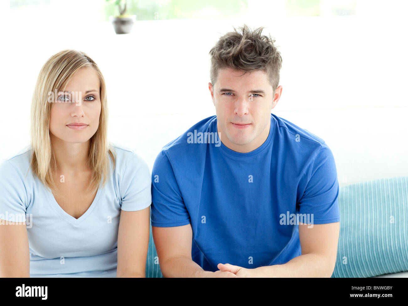 Adorable couple having fun together in the living-room Stock Photo - Alamy