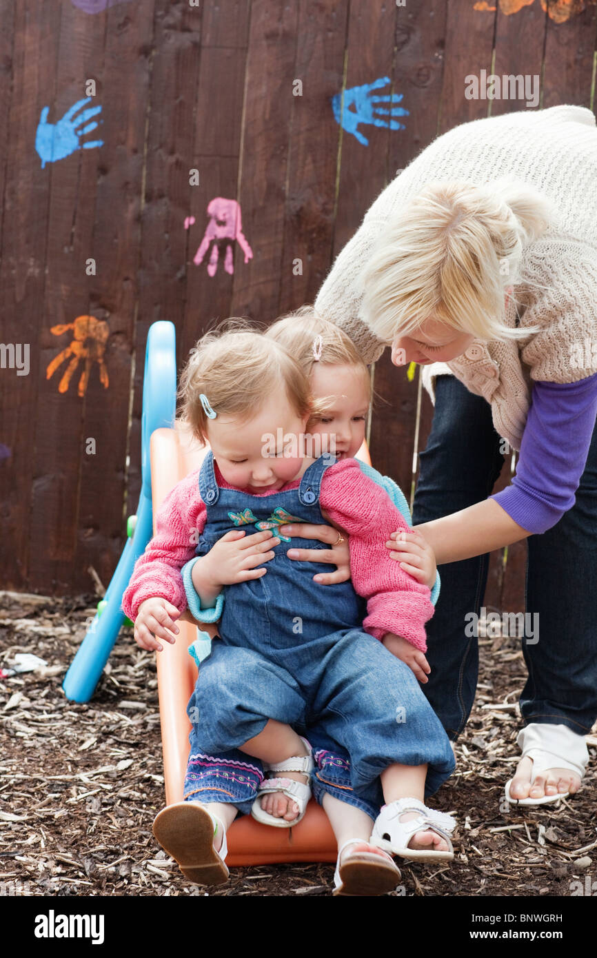 Two sisters are sliding Stock Photo - Alamy