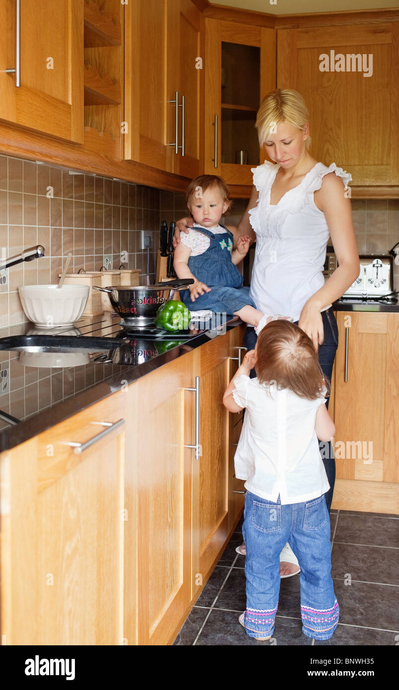 Family in the kitchen Stock Photo - Alamy