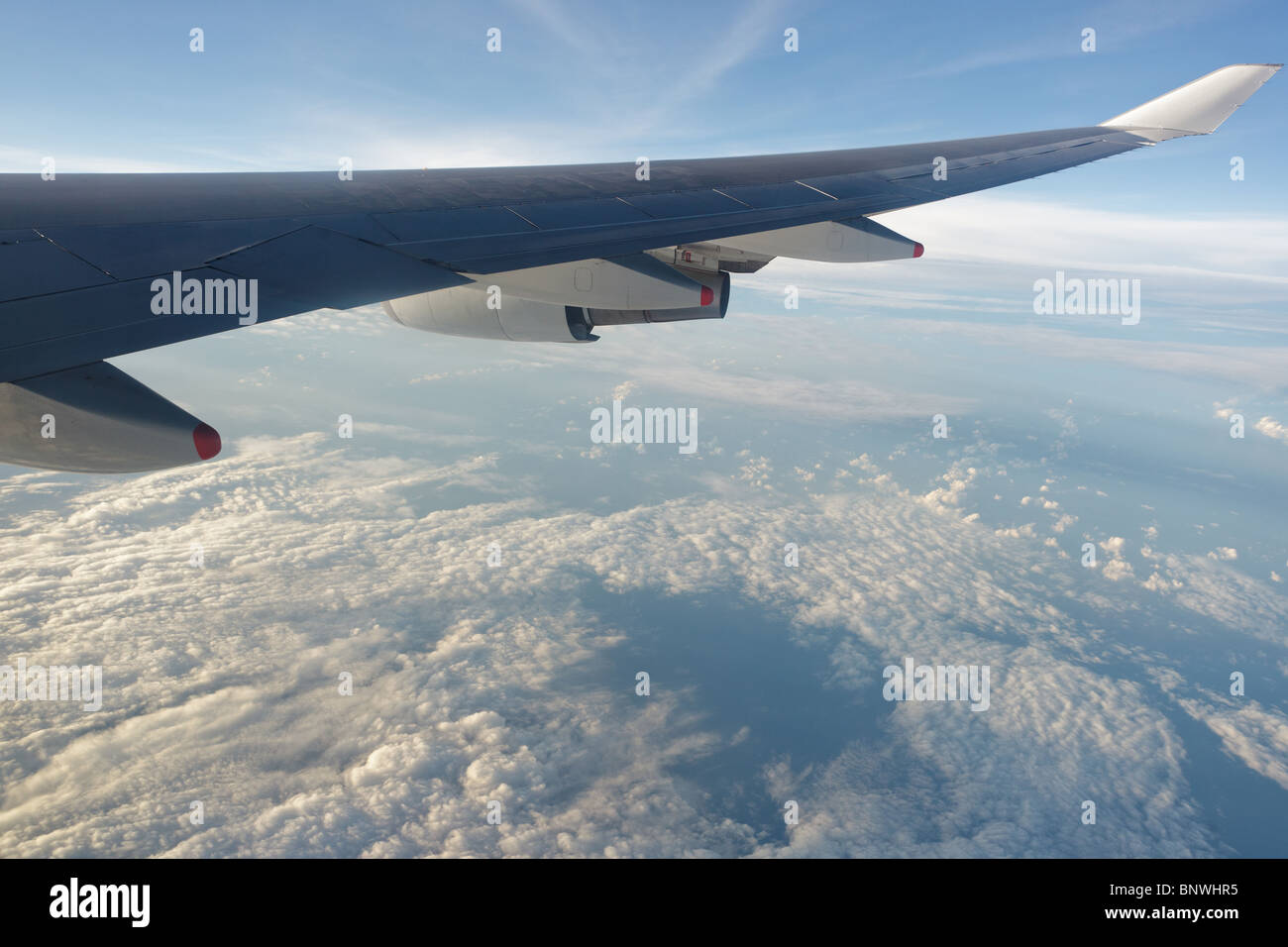 heavy cloudscape view from large airplane window Stock Photo - Alamy