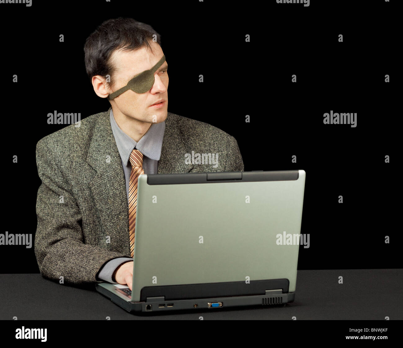The young man - the computer pirate with the laptop Stock Photo - Alamy