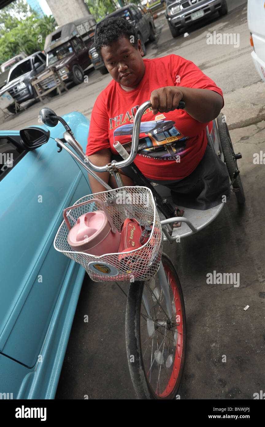 disabled man without legs parking his hand pedaling bicycle , klong ...