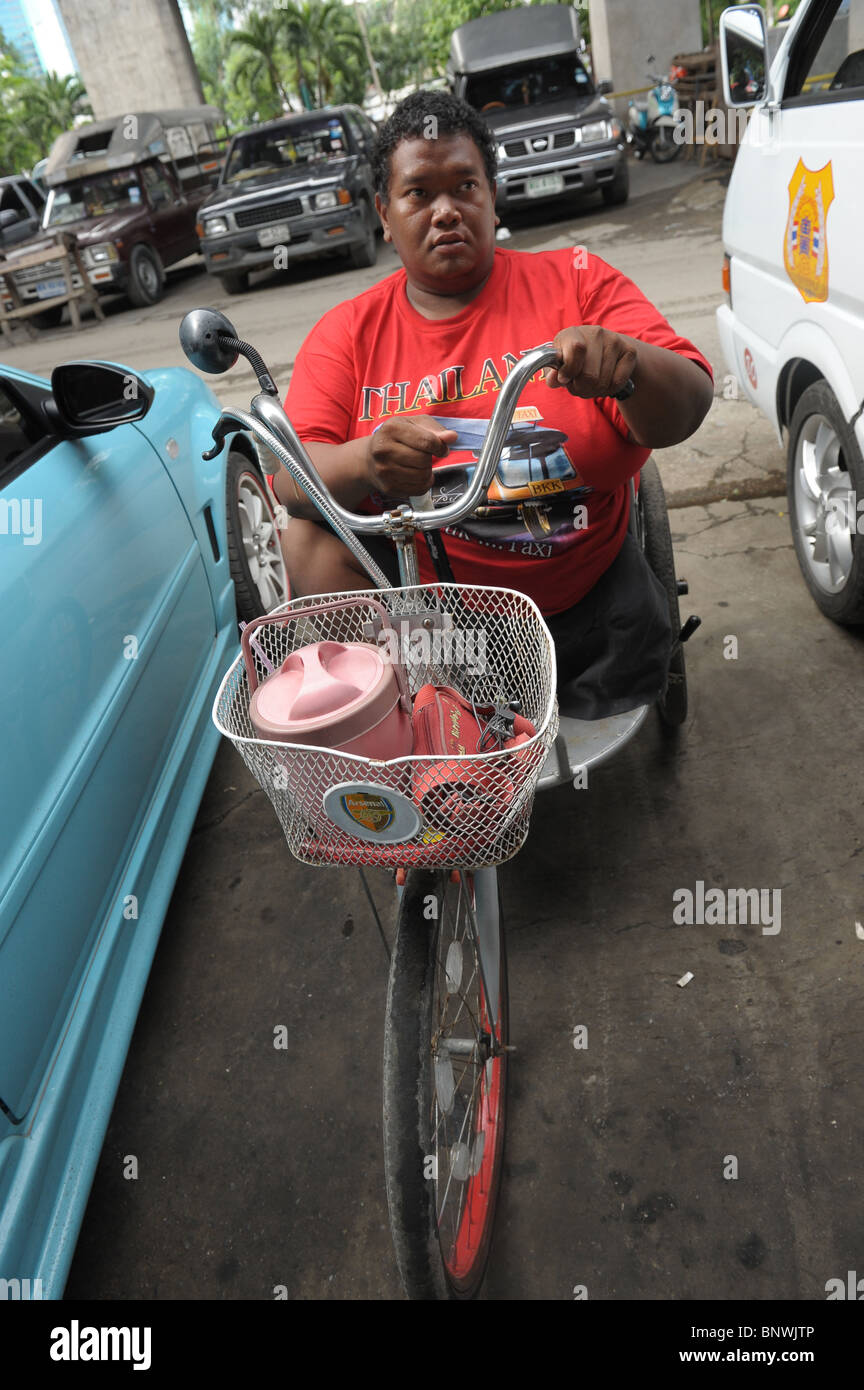 disabled man without legs parking his hand pedaling bicycle , klong ...