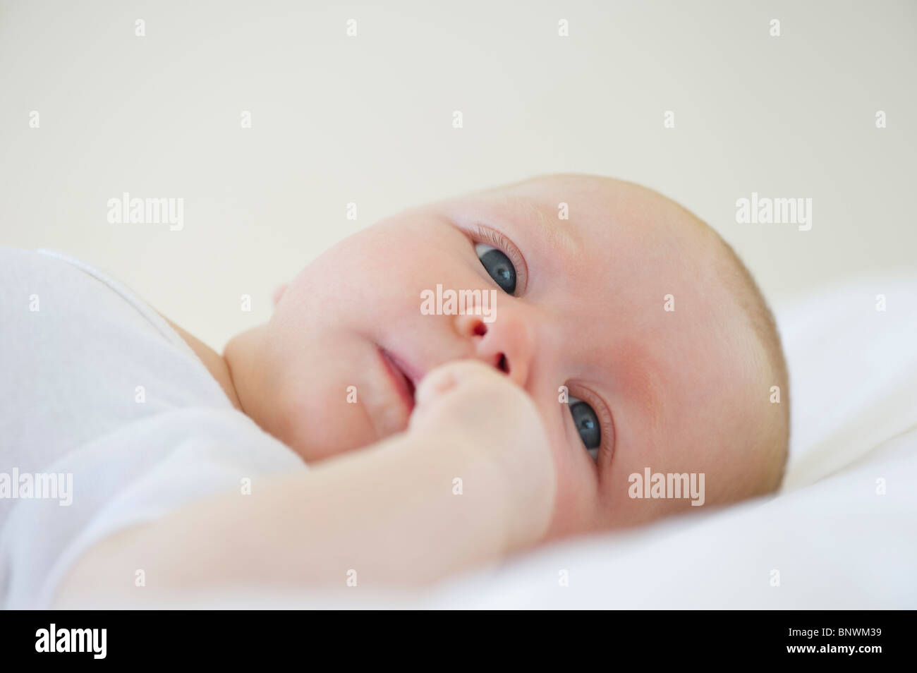 Infant lying on his back Stock Photo - Alamy