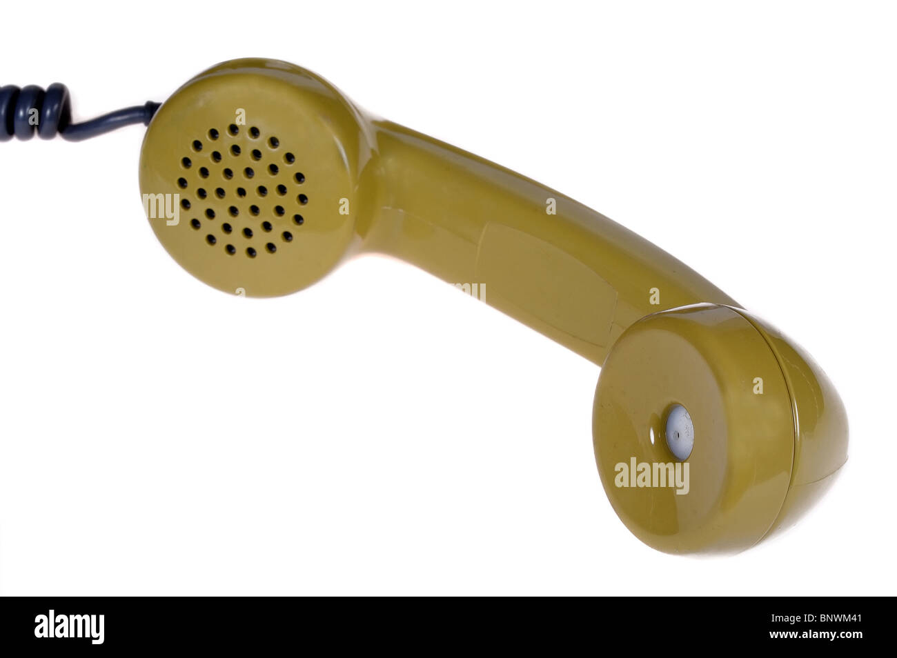Green old telephone receiver isolated on a white background. The focus ...