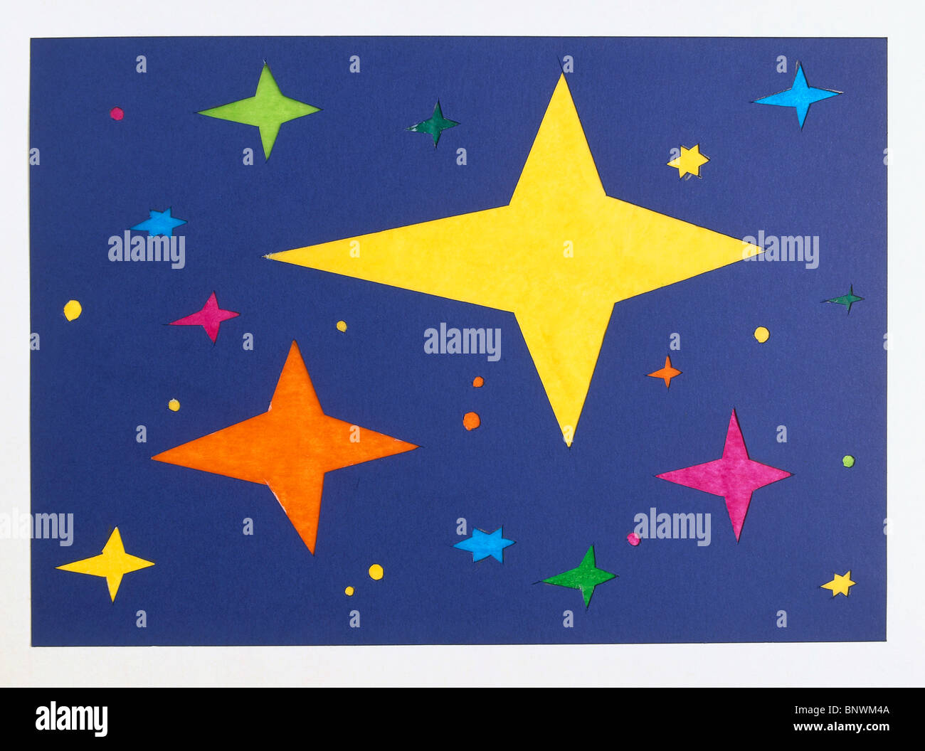 Coloured stars on dark blue paper Stock Photo - Alamy