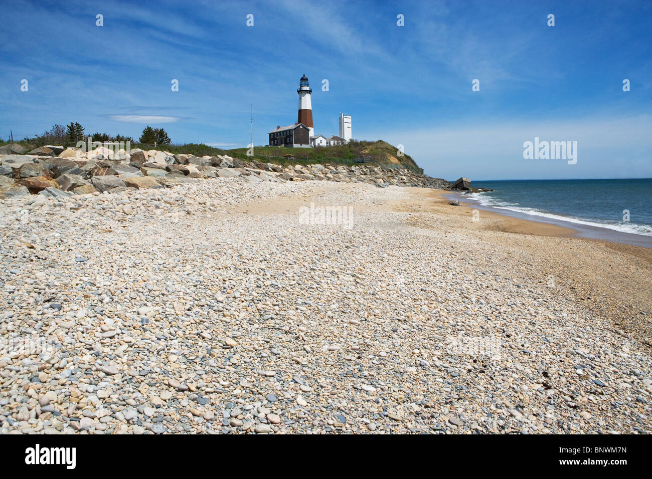 Beach with lighthouse in background Stock Photo - Alamy