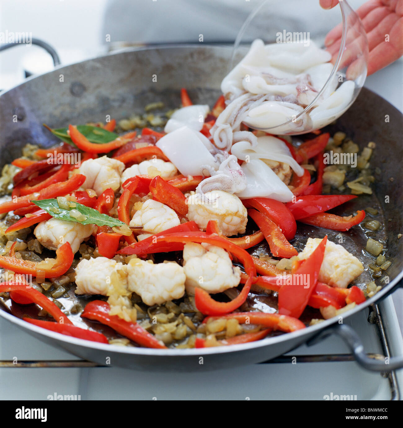 Holding seafood paella pan hi-res stock photography and images - Alamy