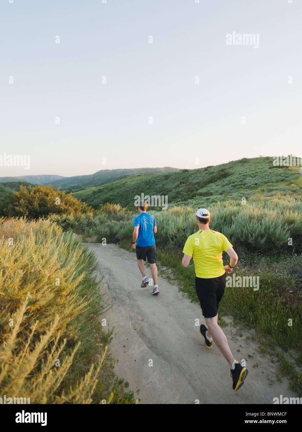 Two trail runners run hi-res stock photography and images - Alamy