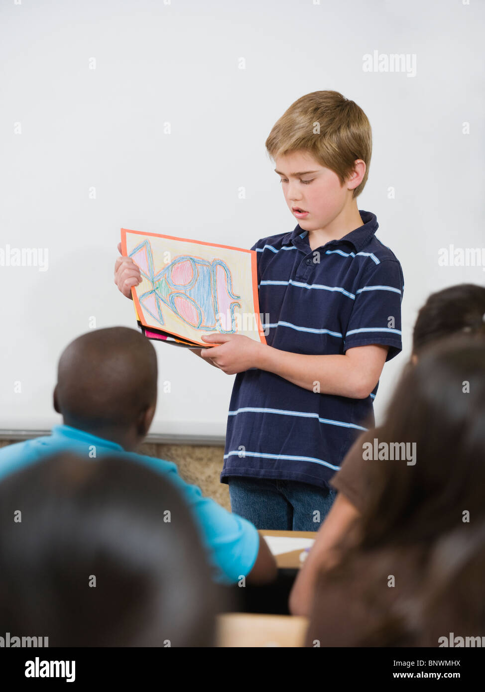 Elementary student giving class presentation Stock Photo - Alamy