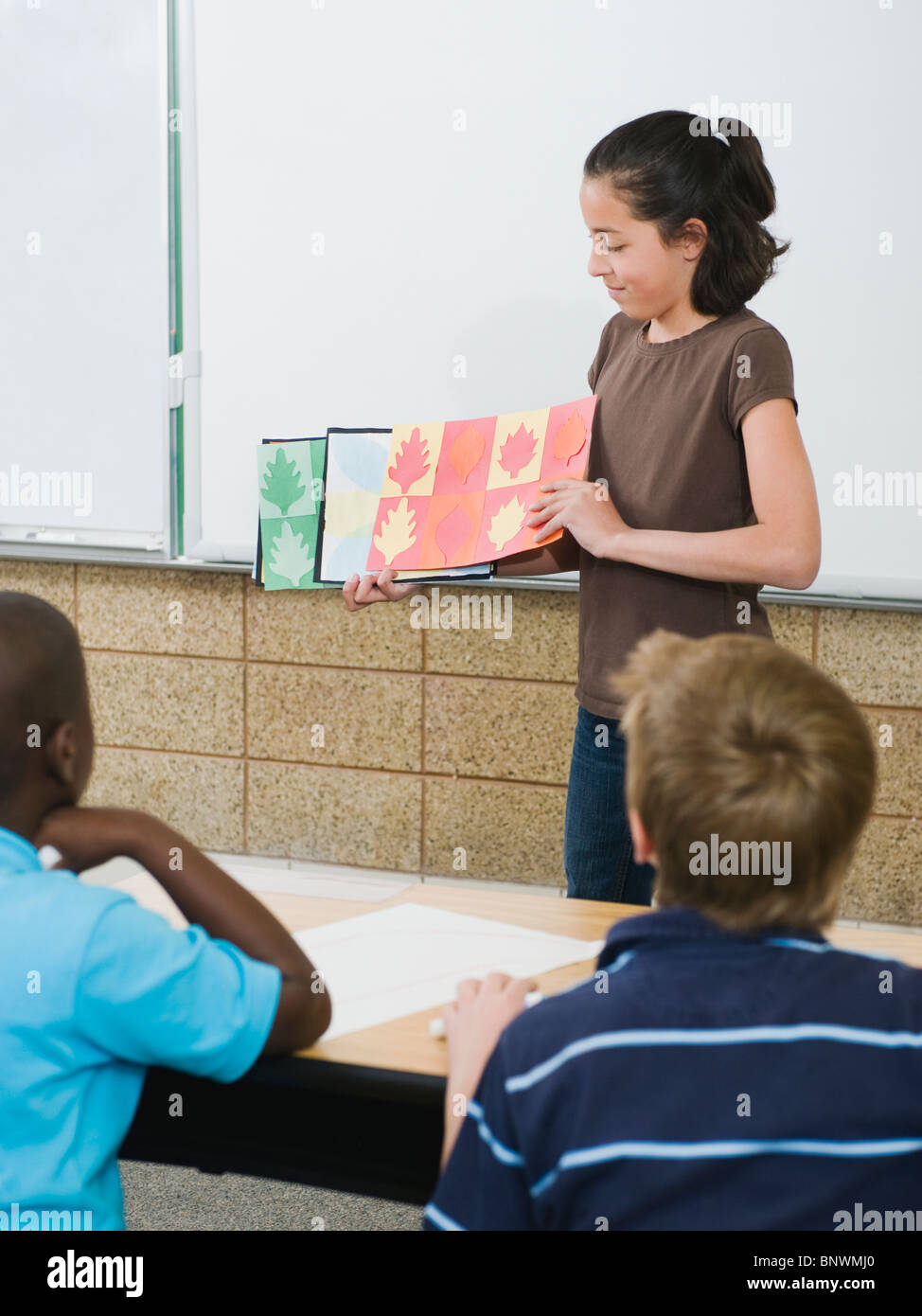 Elementary student giving class presentation Stock Photo - Alamy
